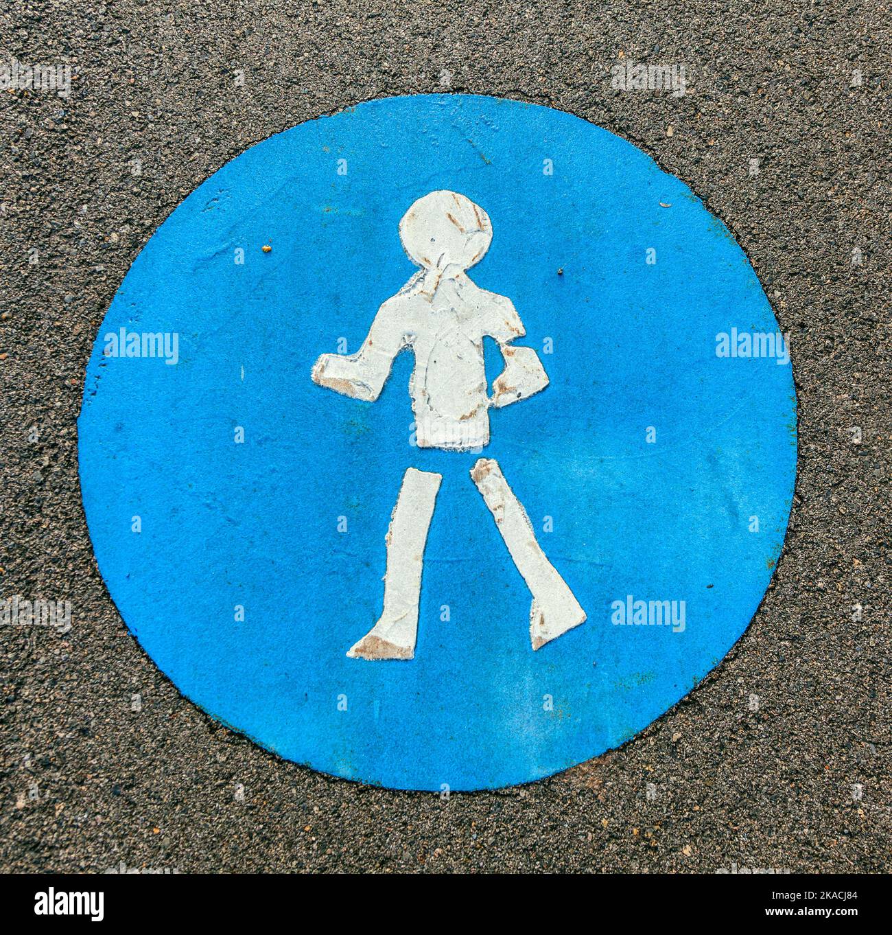 symbol for pathway and icon for pedestrians on asphalt Stock Photo - Alamy