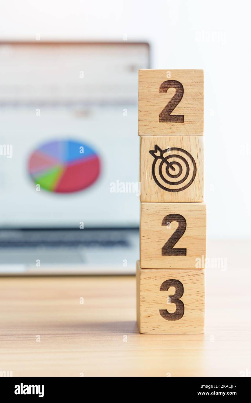 2023 Year block with dartboard icon against computer laptop background. Goal, Target, Resolution ...