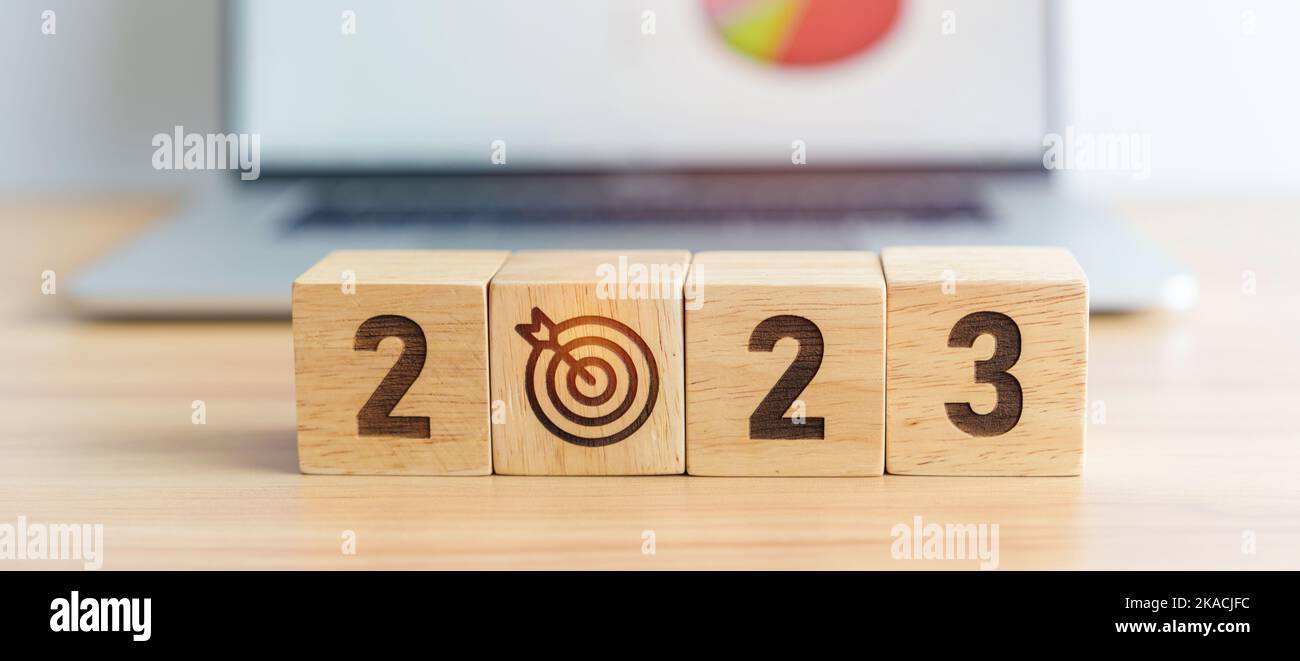 2023 Year block with dartboard icon against computer laptop background. Goal, Target, Resolution ...