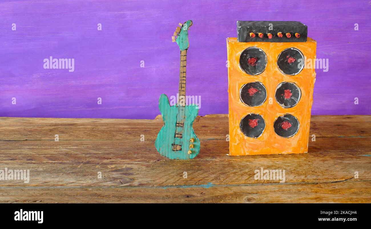Grungy cardboard model of a guitar and an amp stack,music, live ...