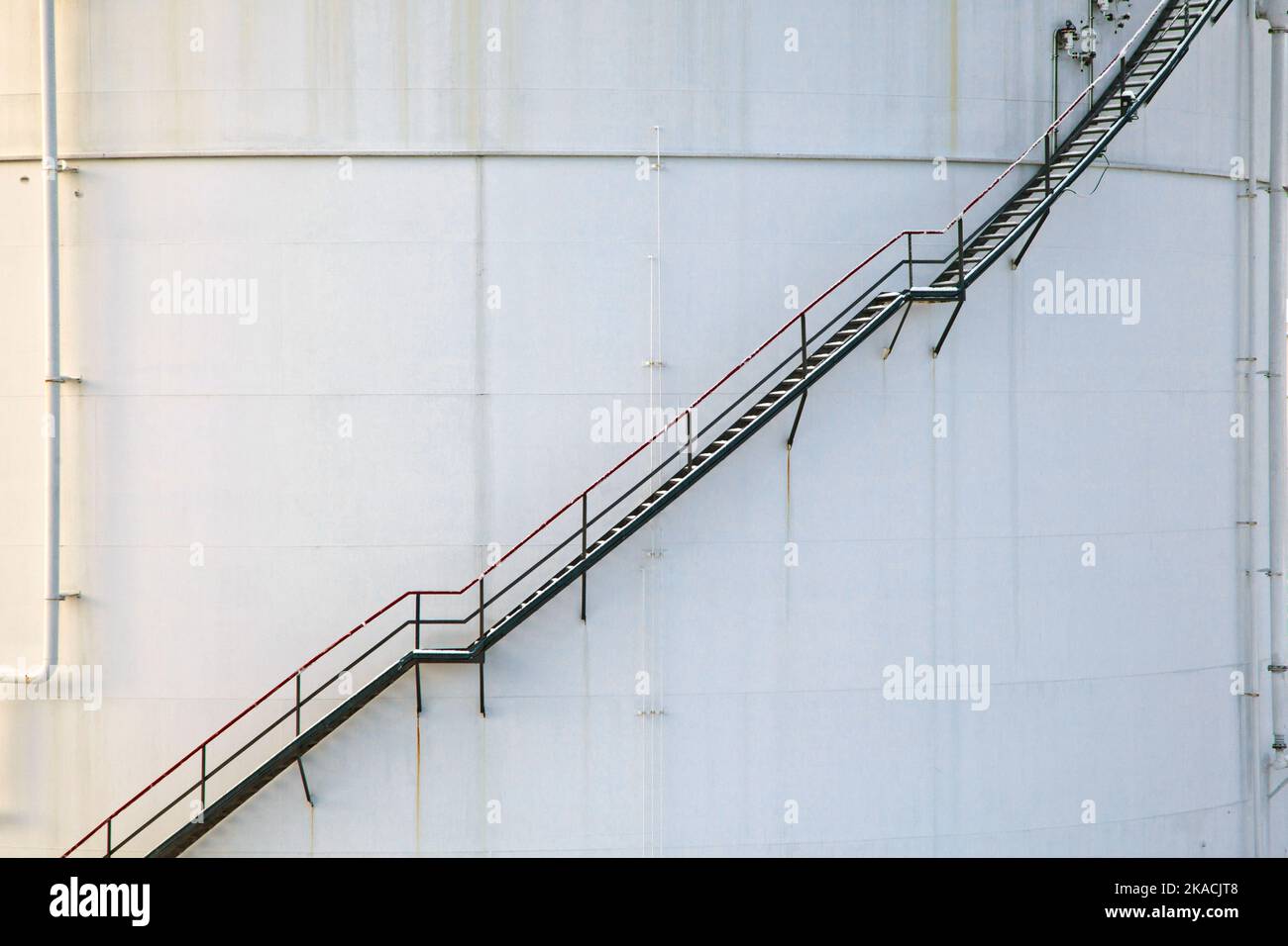 white tanks in tank farm with iron staircase in snow Stock Photo - Alamy