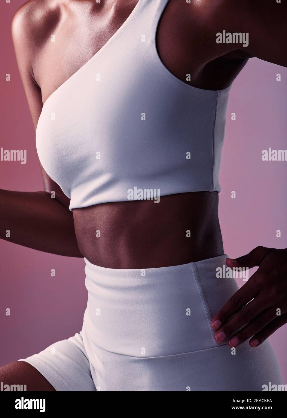 Woman, runner athlete and abdomen closeup for sportswear advertising or ...