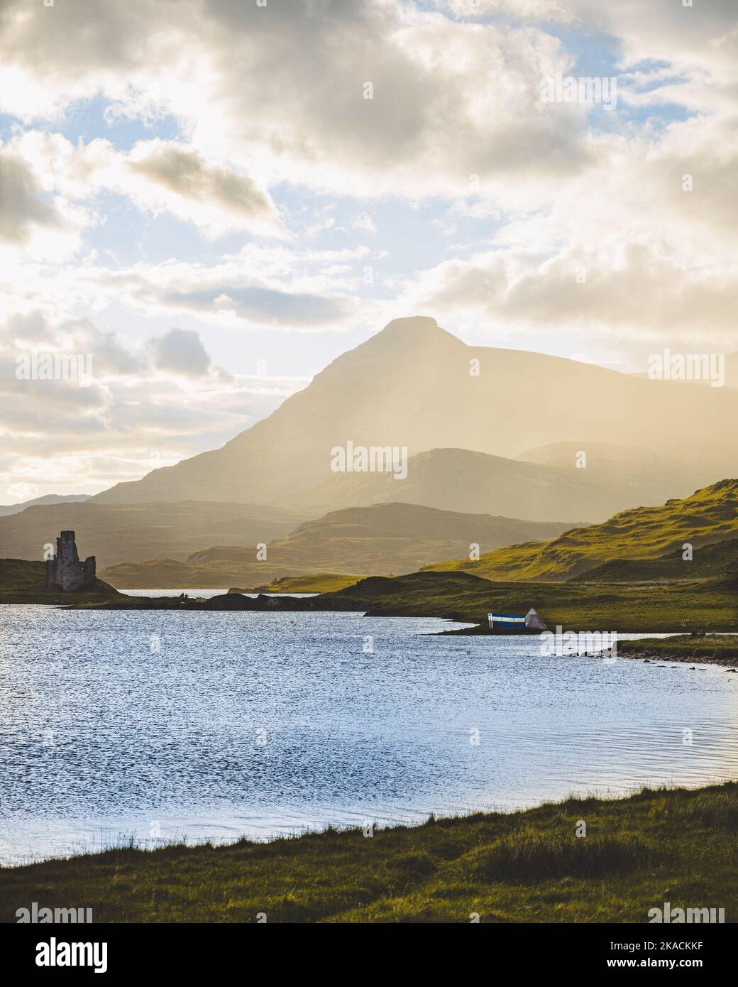 Fog engulfing a mountain in the Scottish Highlands next to a large Loch ...