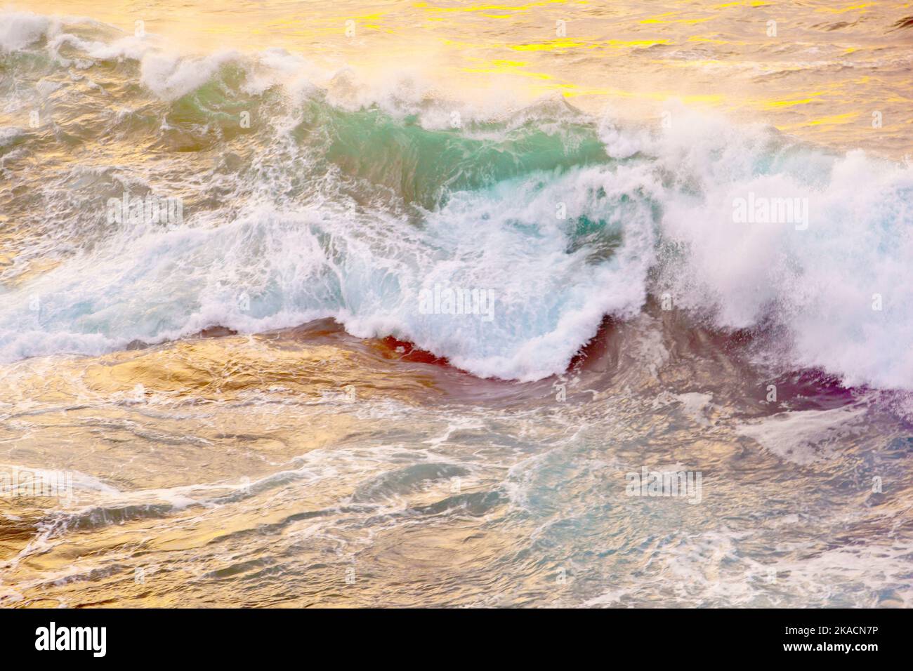 beautiful waves at the beach in sunset Stock Photo - Alamy