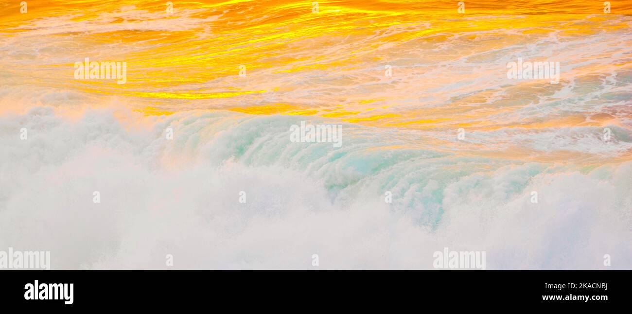 beautiful waves at the beach in sunset Stock Photo - Alamy
