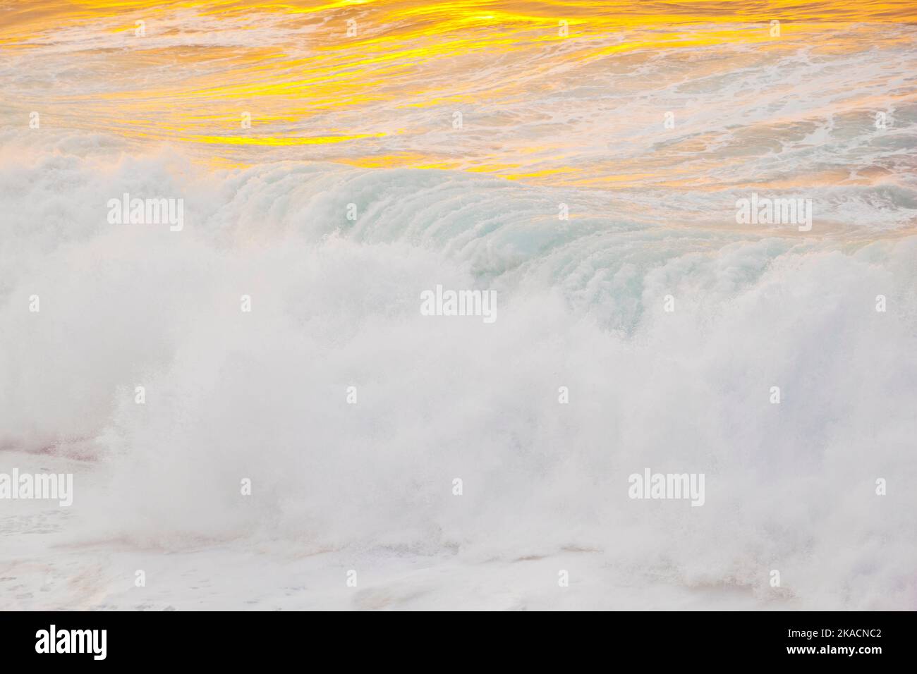 beautiful waves at the beach in sunset Stock Photo - Alamy