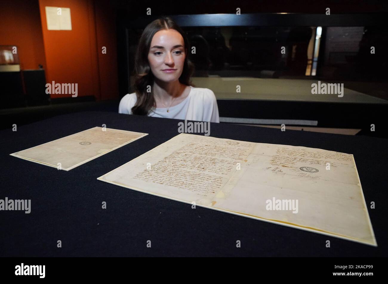 A member of staff looks at the Monteagle letter (left), and the signed ...