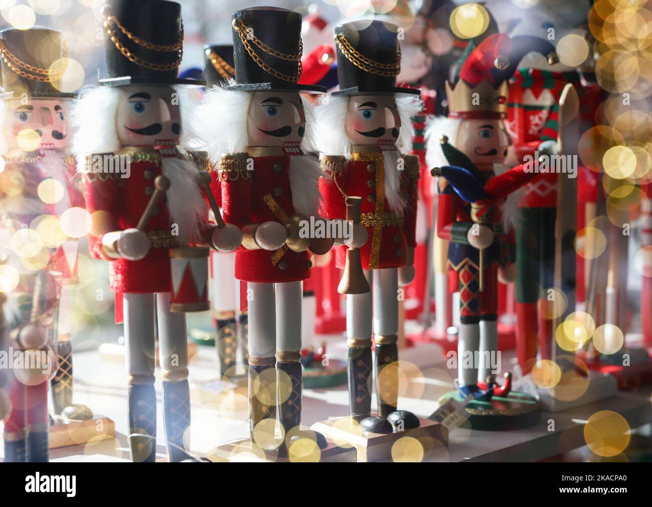 Nutcracker toys row on store shelf with blurred Christmas lights Stock ...