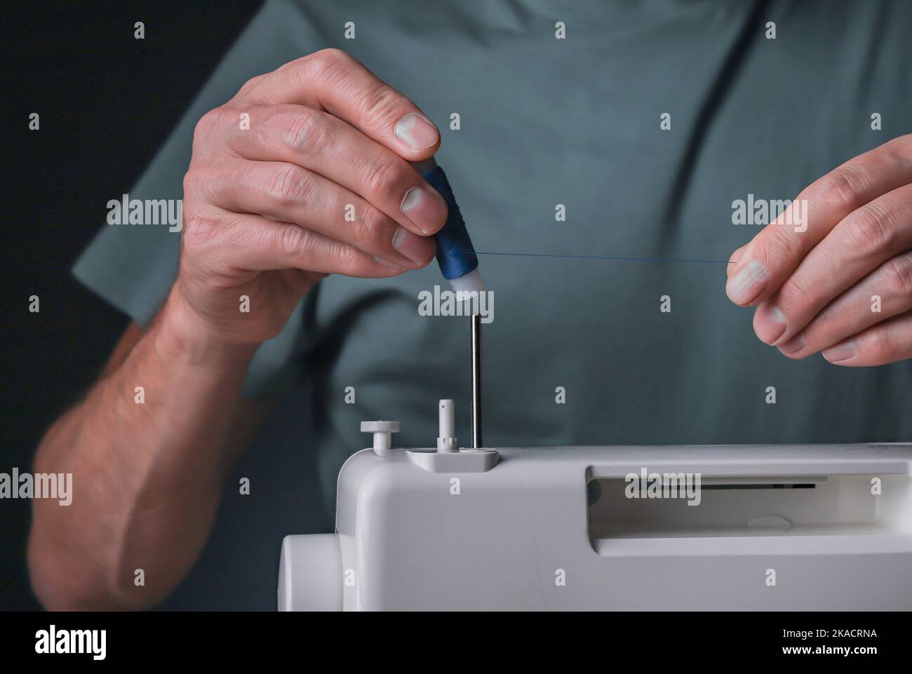 Close up male hands thread hi-res stock photography and images - Alamy