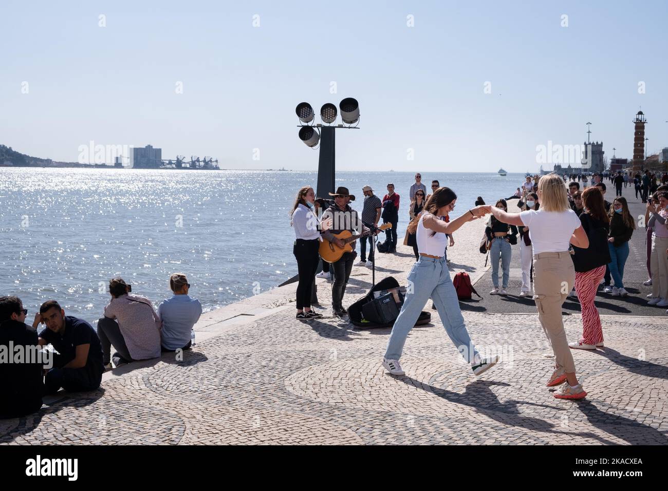 DANCING TOURISTS, LISBON: Tourists dance on the Tejo Promenade of River Tagus (Rio Tejo), Lisbon ...