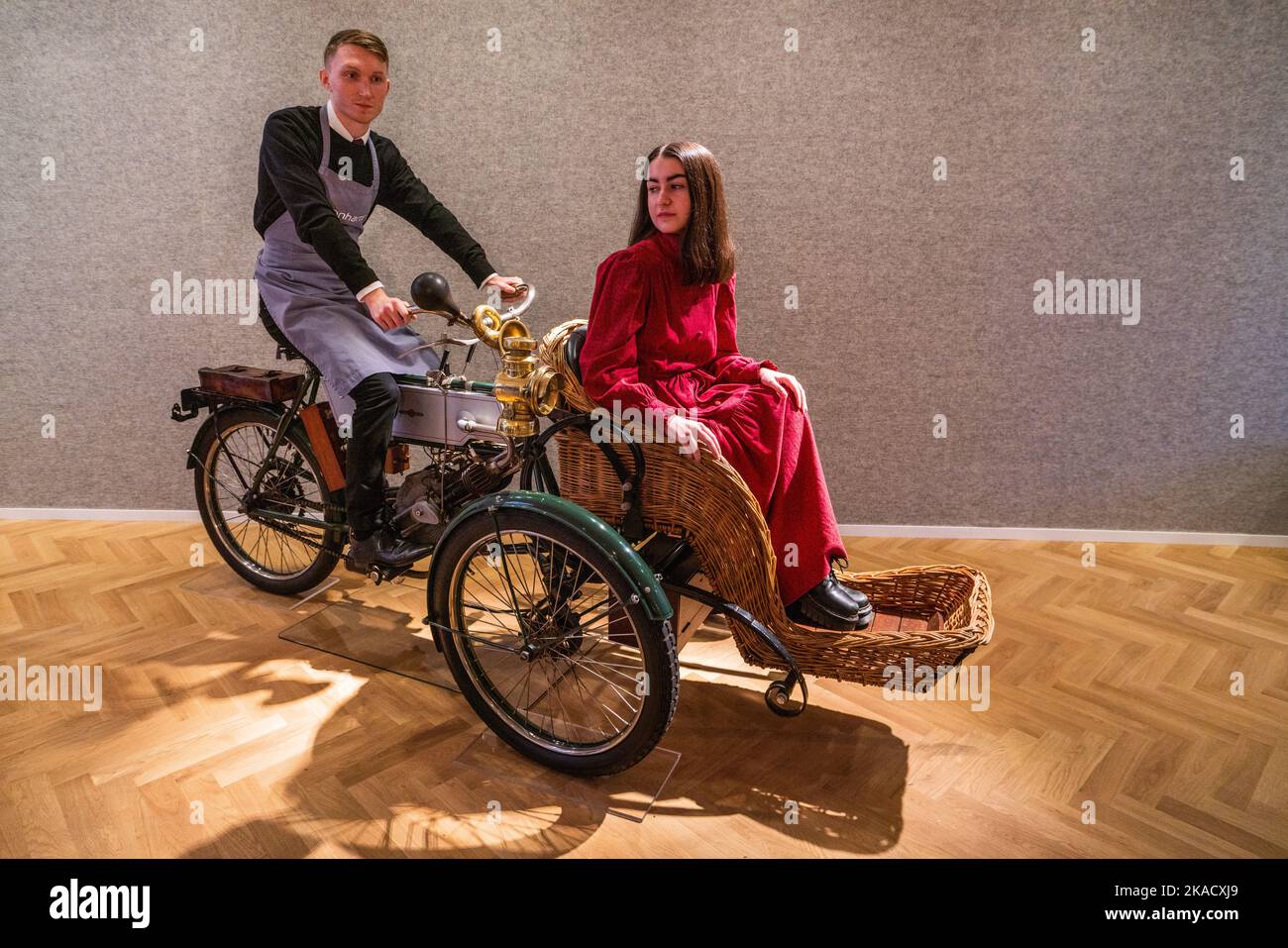 London UK. 2 November 2022. Bonhams assistants riding a 1903 Humber ...