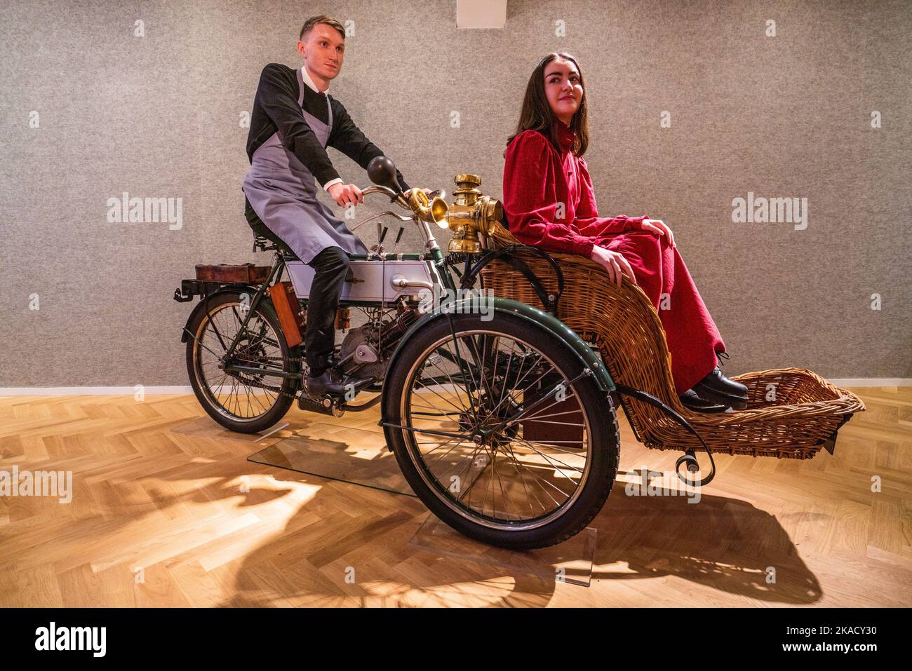 London UK. 2 November 2022. Bonhams assistants riding a 1903 Humber ...