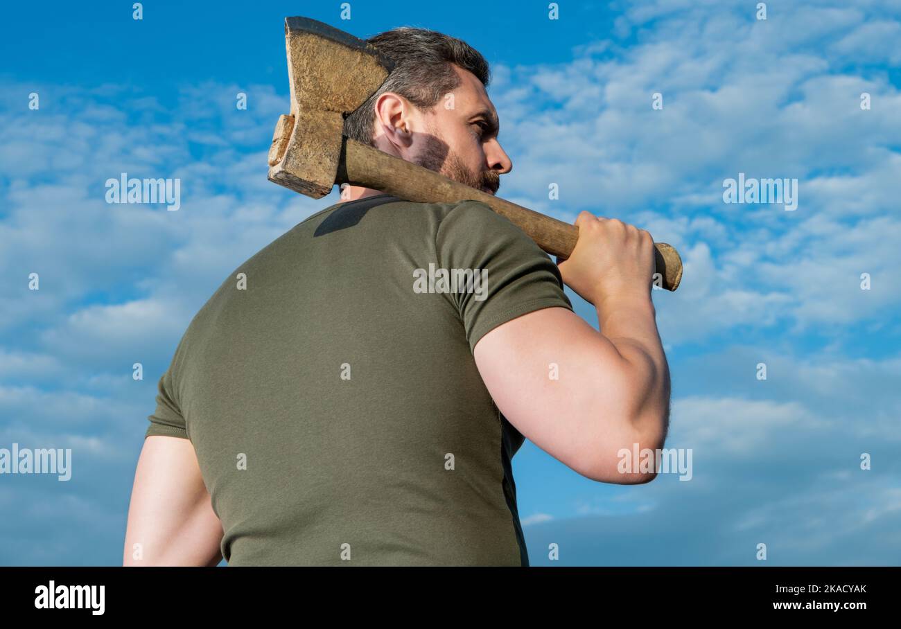 back view of man with axe. lumberjack man hold ax. brutal man on sky ...