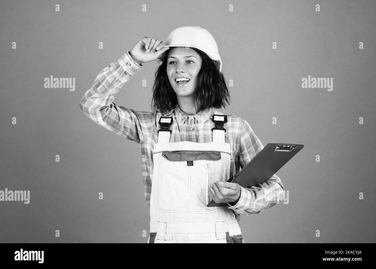 Create your dream home. mechanic girl in hardhat. building and ...