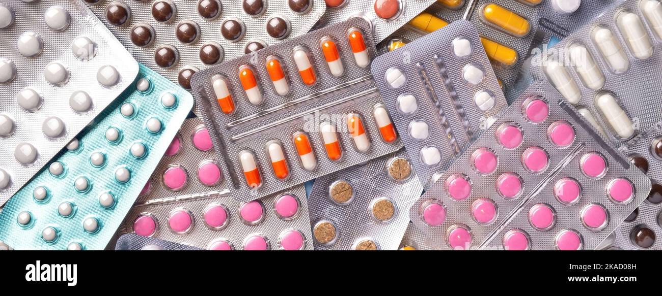 Bunch of pills of different colors in blisters pack, closeup. Medicine ...