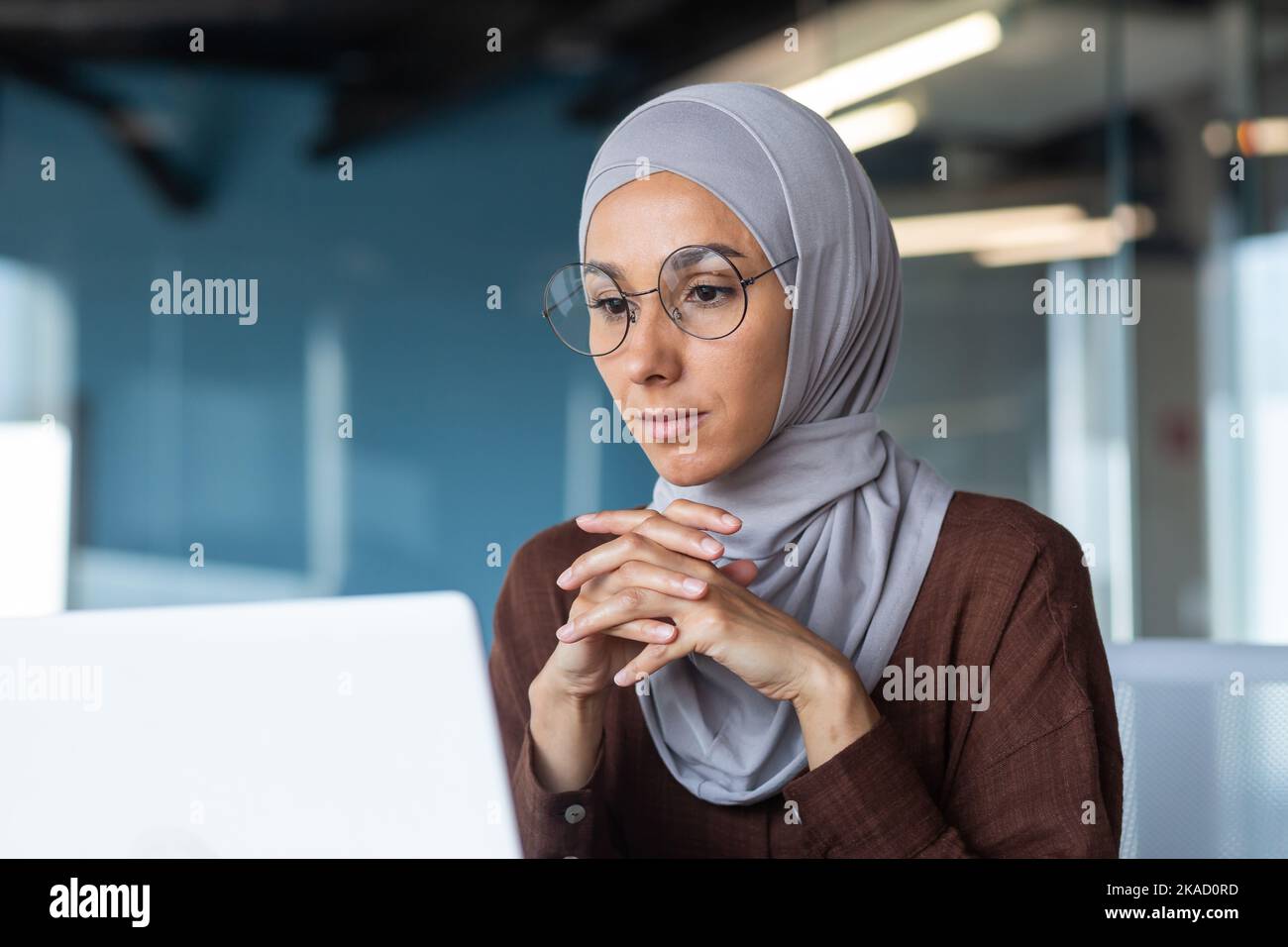 Close-up photo of satisfied business woman looking at laptop screen ...