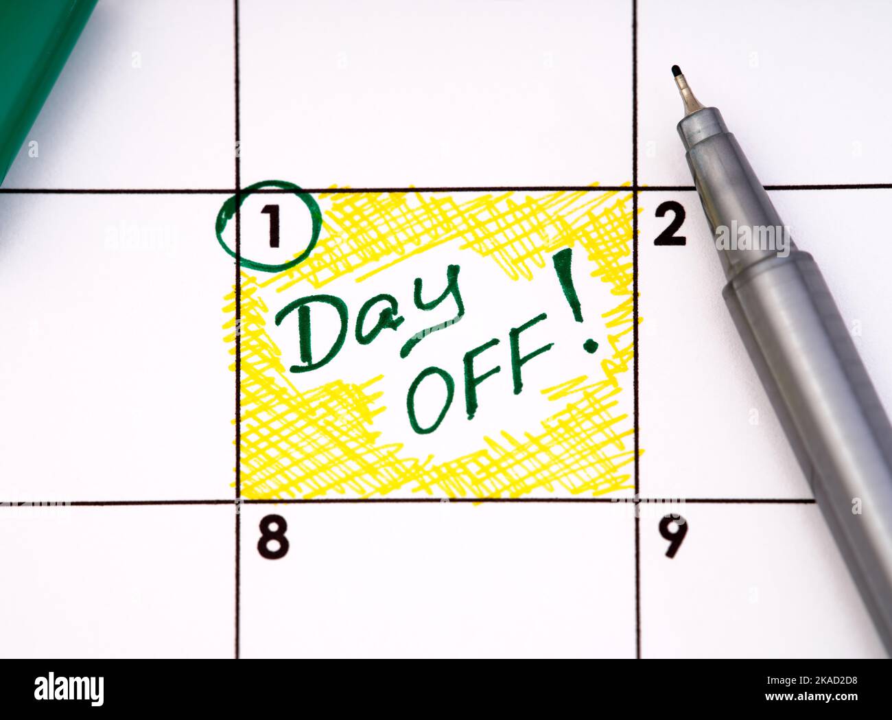 A handwritten reminder for a Day Off in a calendar with a green pen ...