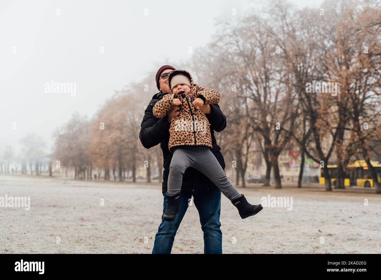 Father playing with child outdoors. Happy parenting, family bond ...