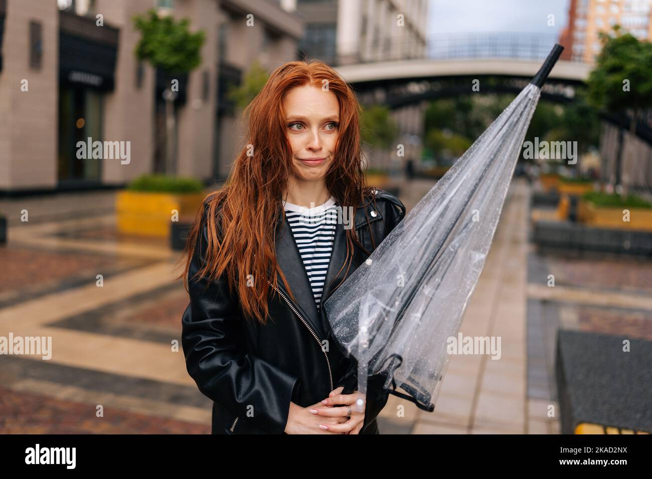 Portrait of disgruntled attractive young woman with long red-hair ...