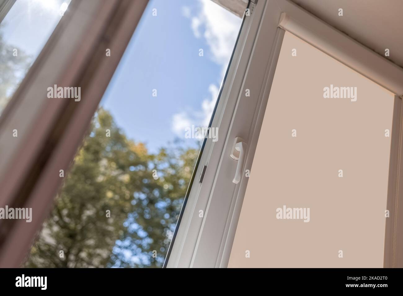 open white pvc plastic window. Airing the room on a fine summer day ...