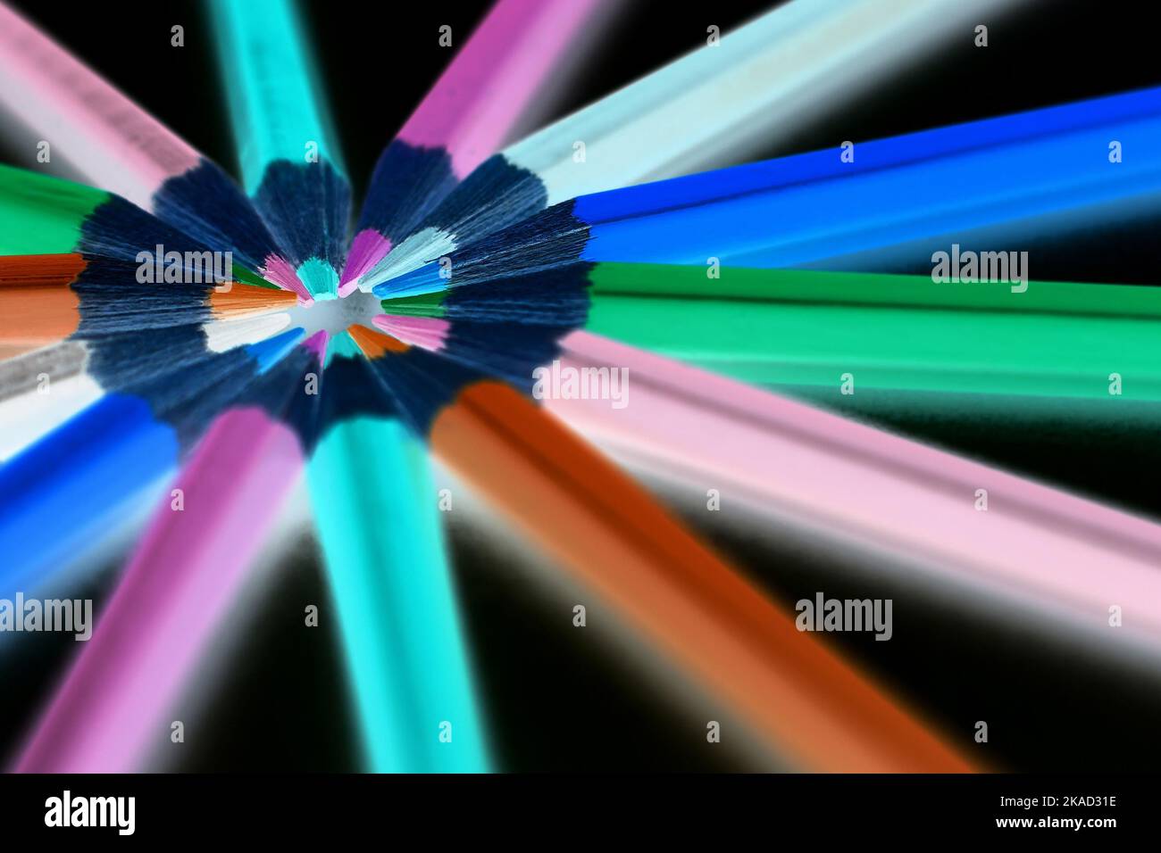 Colored pencils laid out in the shape of the sun in reverse colors ...