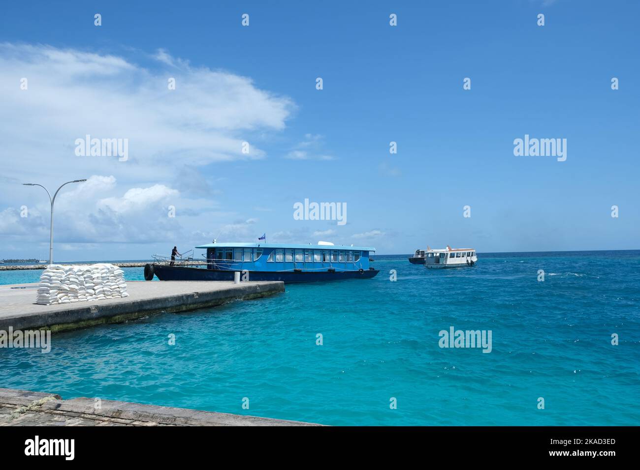 Beautiful afternoon at Rasdhoo harbour. Rasdhoo is an inhabited island ...