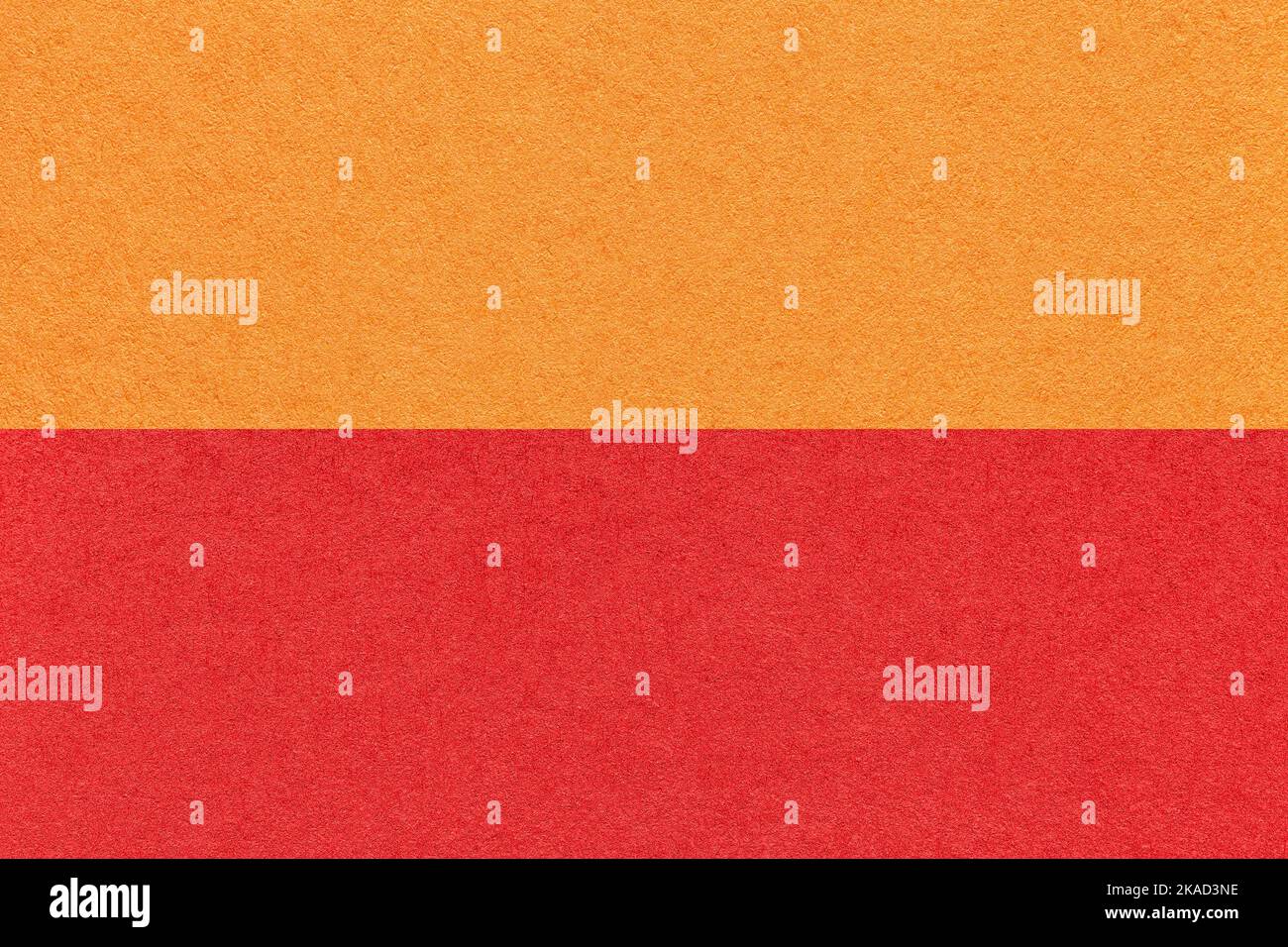 Texture of craft bright orange and red paper background, half two ...