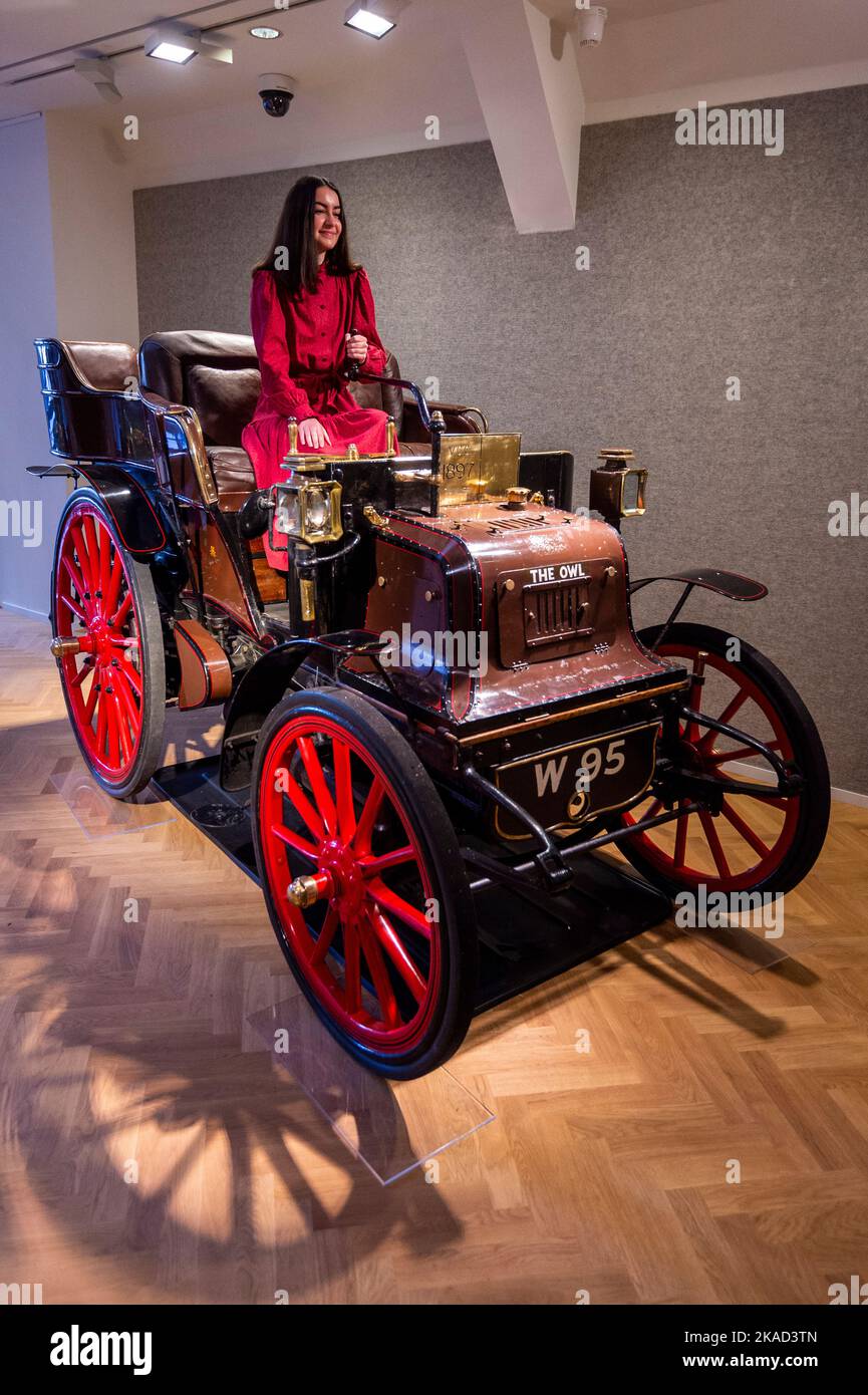 London, UK. 2 November 2022. A staff member sits in a 1897 Daimler Twin ...