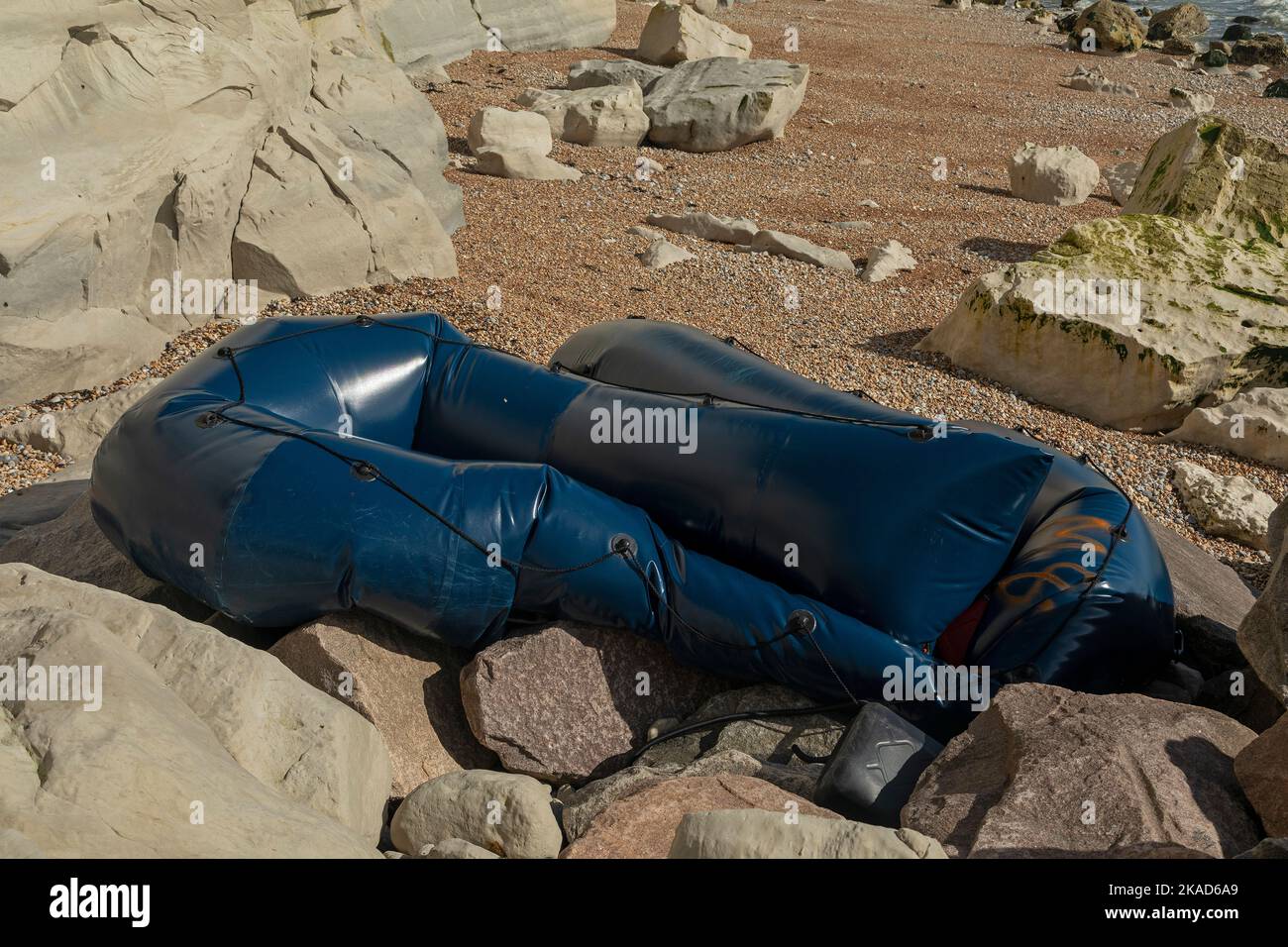 Damaged rubber dinghy at the beach, Samphire Hoe country park, Kent ...