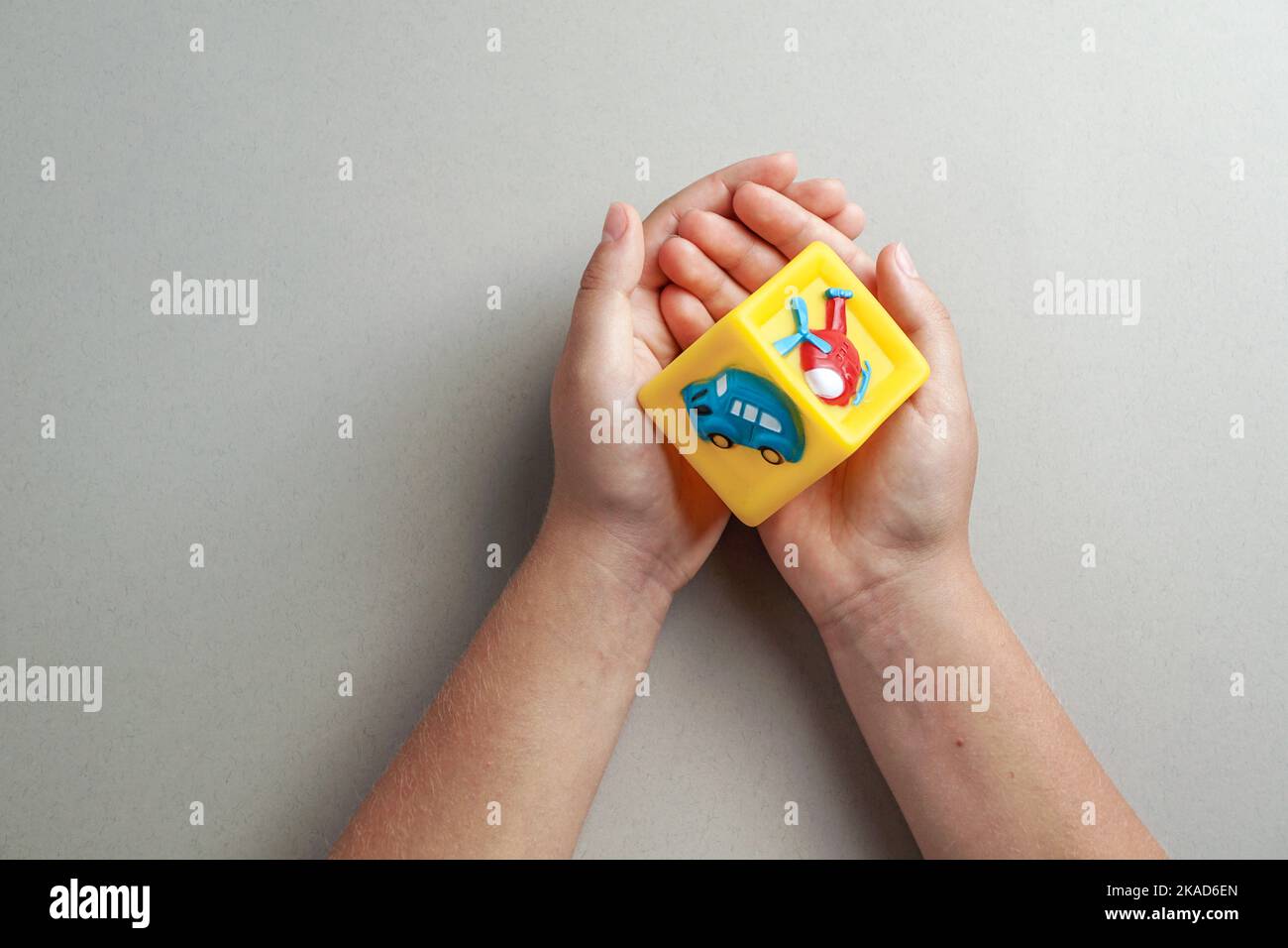 Car Protection Small Yellow Cube with Car and Helicopter Covered by ...