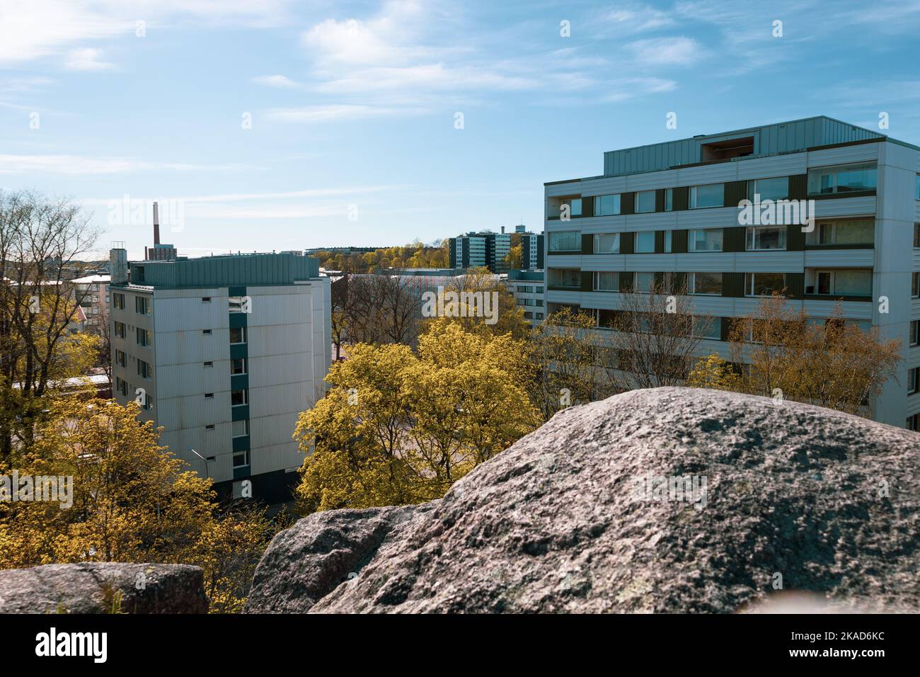 A beautiful exterior design of modern buildings with trees behind a big ...