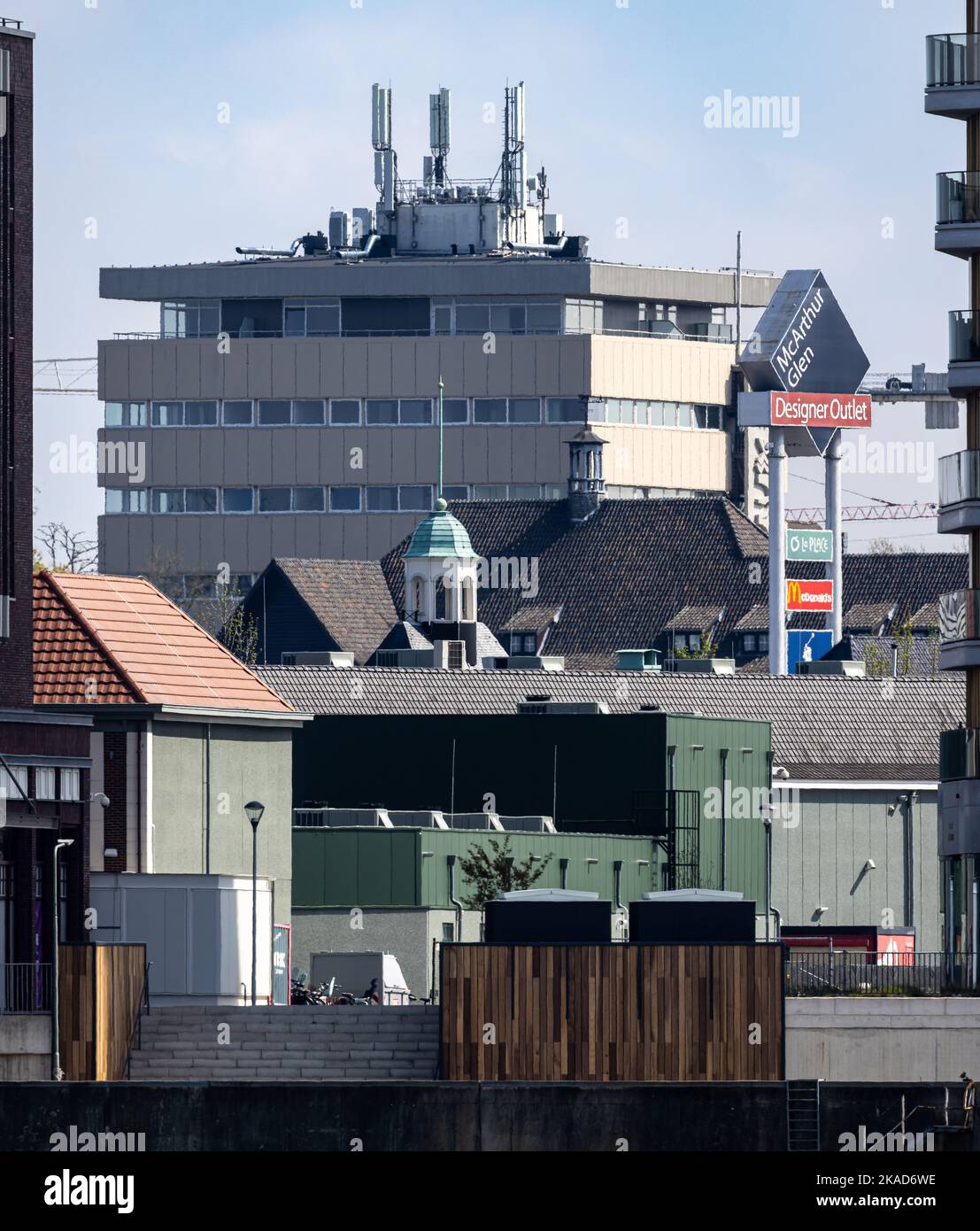 A vertical shot of the Roermond Outlet sign with the outlet underneath ...