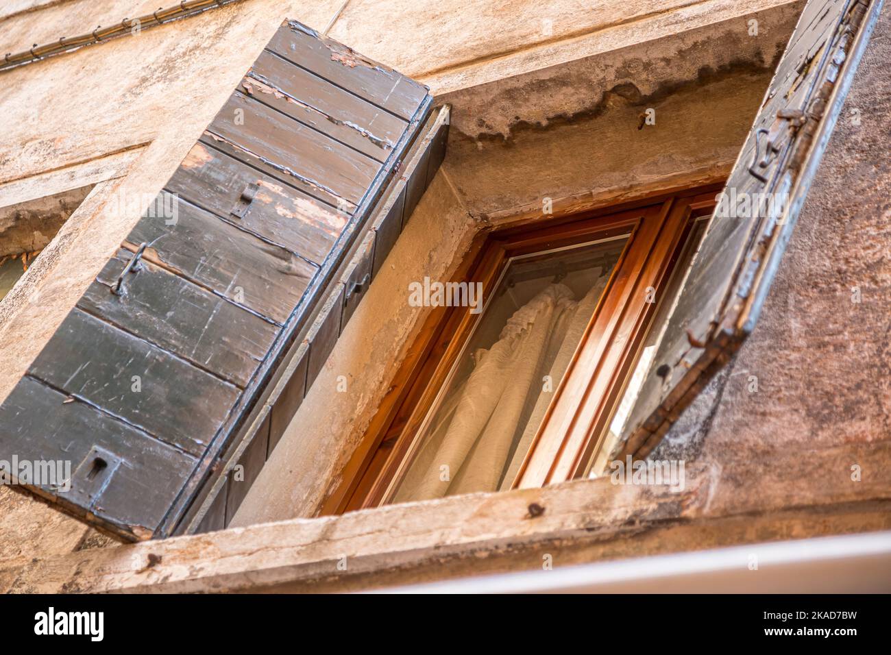 window with brown shutters on the window sill Stock Photo - Alamy