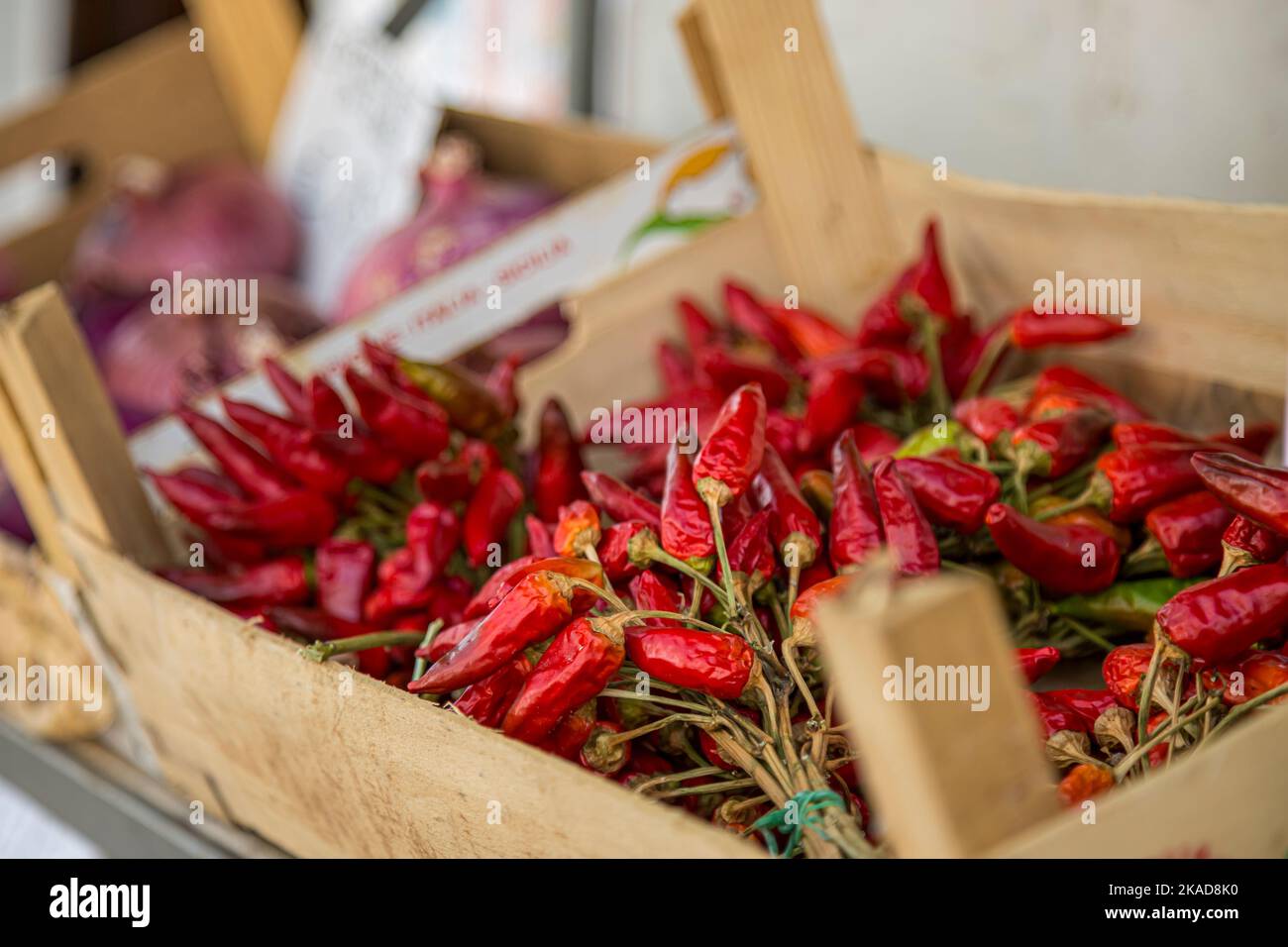 Wooden boxes full of bright red chili peppers on the open market Stock ...
