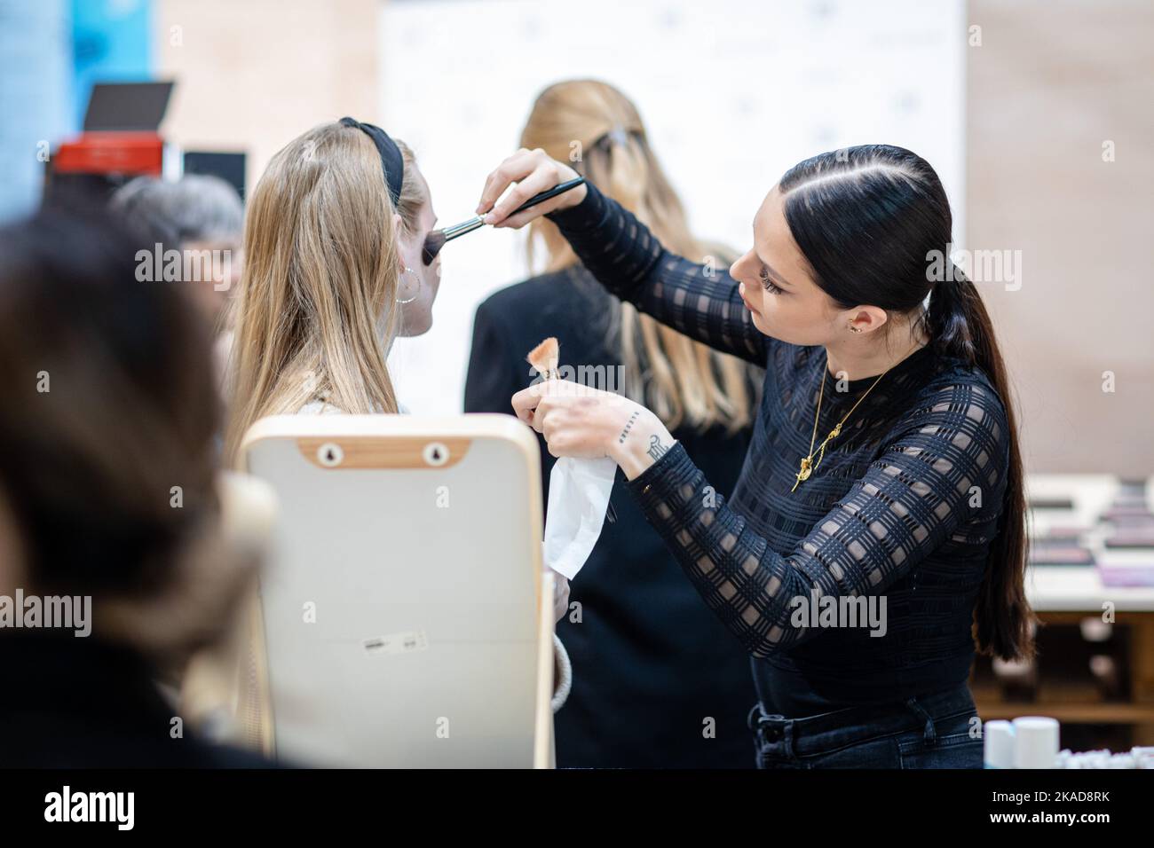 A lady getting her makeup done at BEA Expo in Bern, Switzerland Stock ...