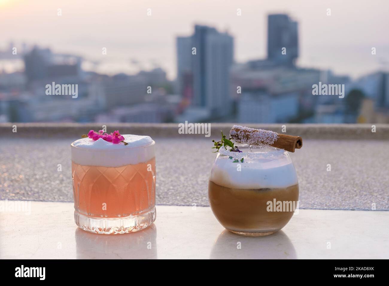cocktail drinks on a rooftop bar in Pattaya Thailand during sunset ...
