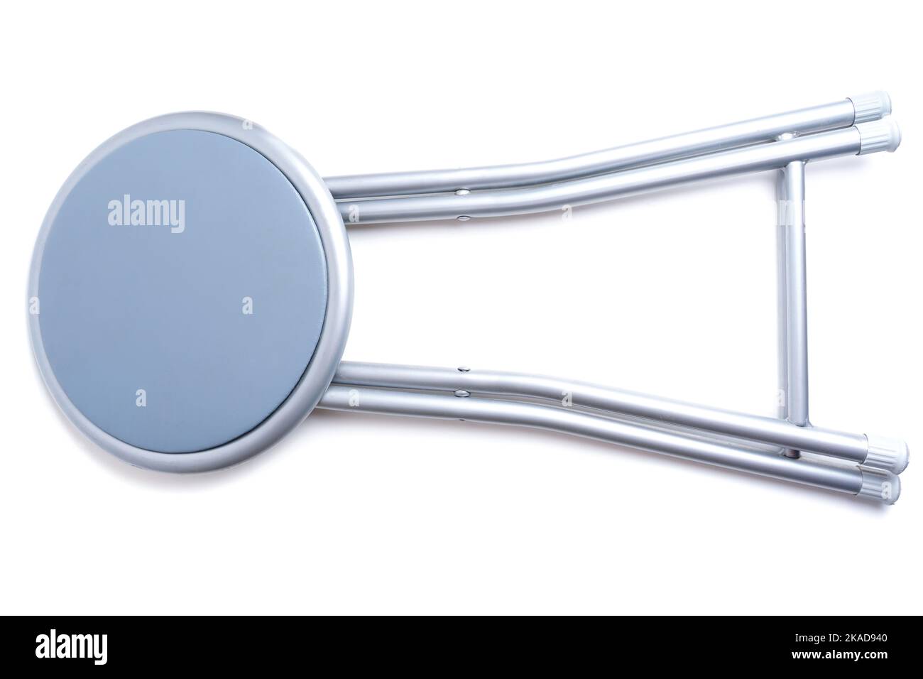 Collapsed padded gray foldable stool isolated on white background Stock ...