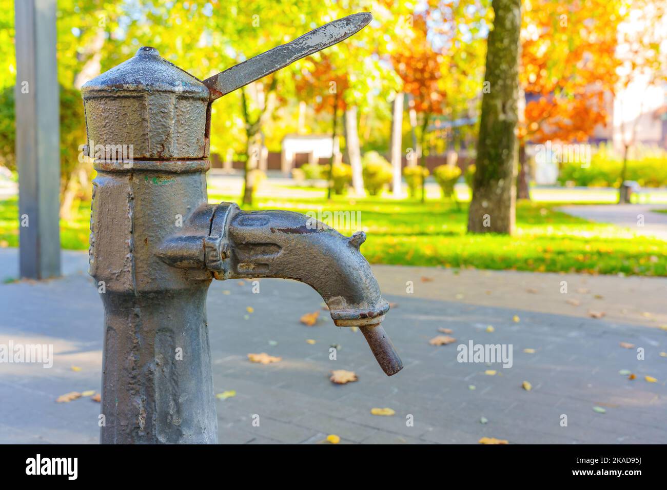 Weathered cast iron water pump at the local park Stock Photo - Alamy