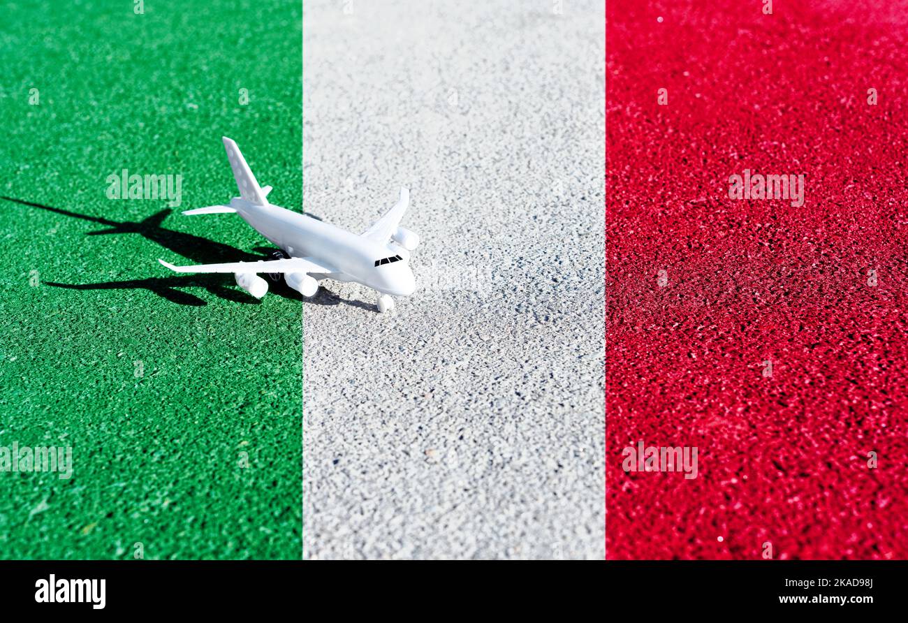 Toy airplane placed on the road painted the colors of the national flag ...