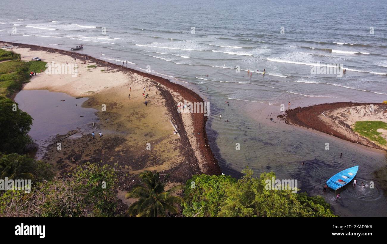 An aerial view of people having fun at the beautiful beach in Chaguanas ...