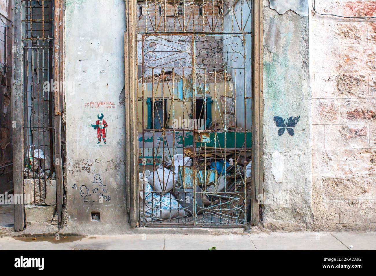 Damaged dirty facade of an old building. The collapsed structure has a ...