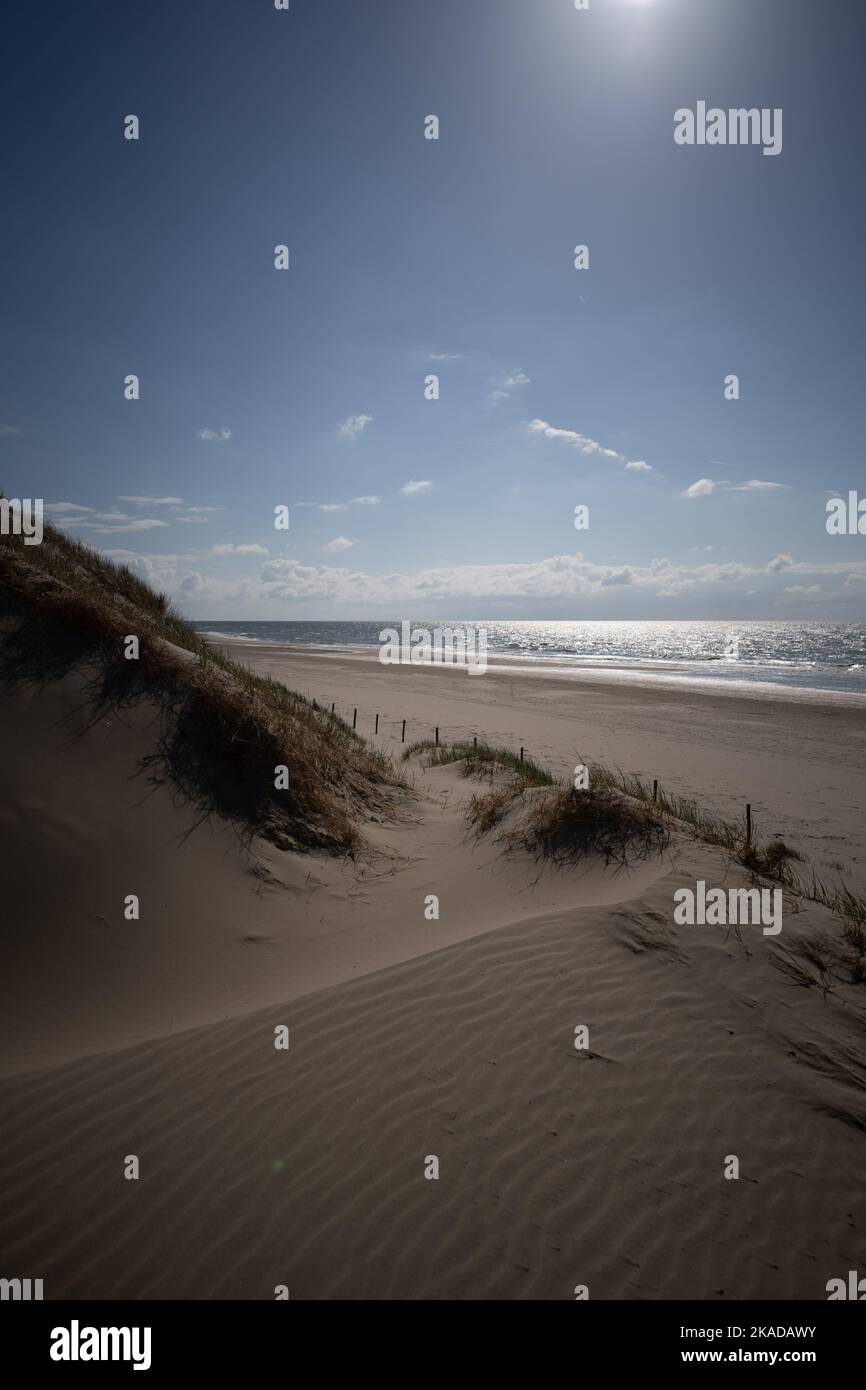 A beautiful sandy beach under a blue cloudy sky on a sunny day Stock ...