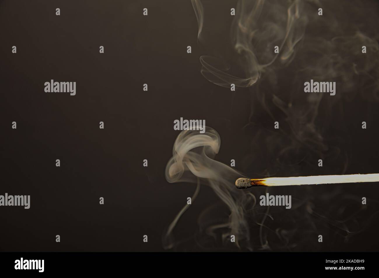 Image of a burned out matchstick with smoke Stock Photo - Alamy
