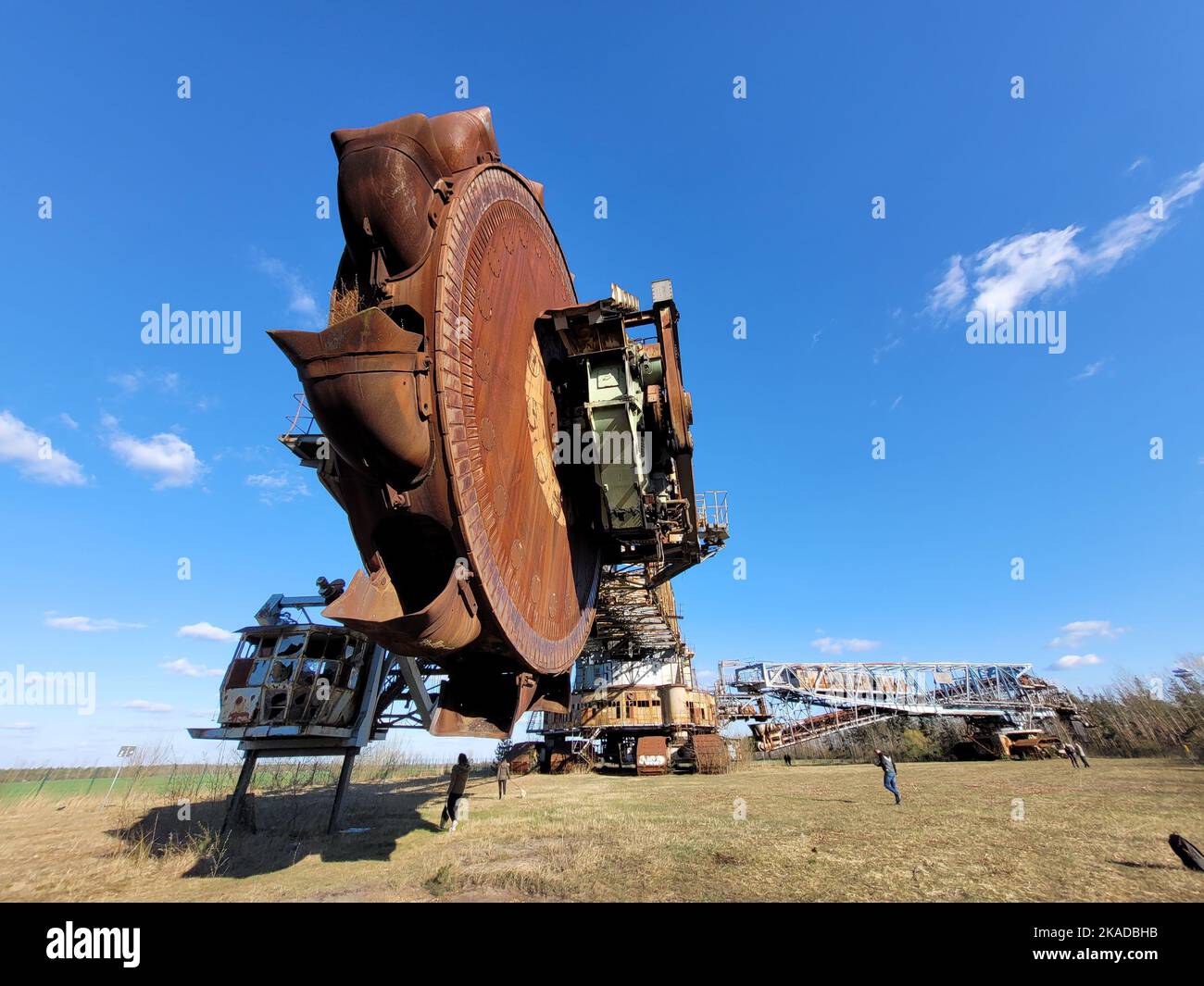 A bucket-wheel excavator Bagger in a reen field under the clear sky ...