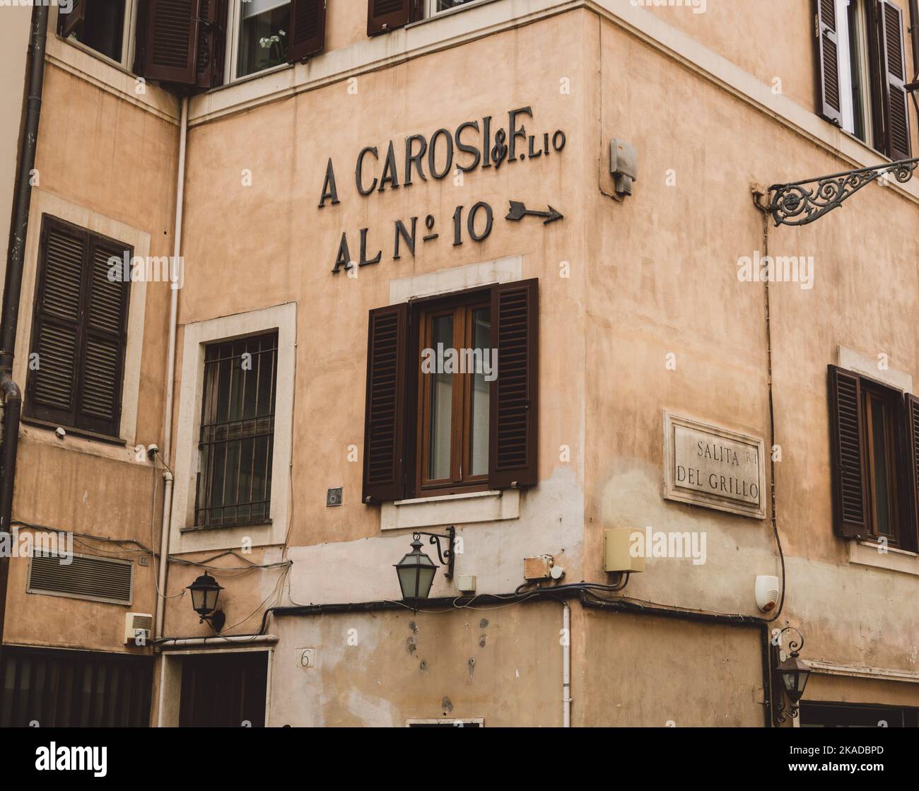 An old medieval building with the street name and number in Rome, Italy ...