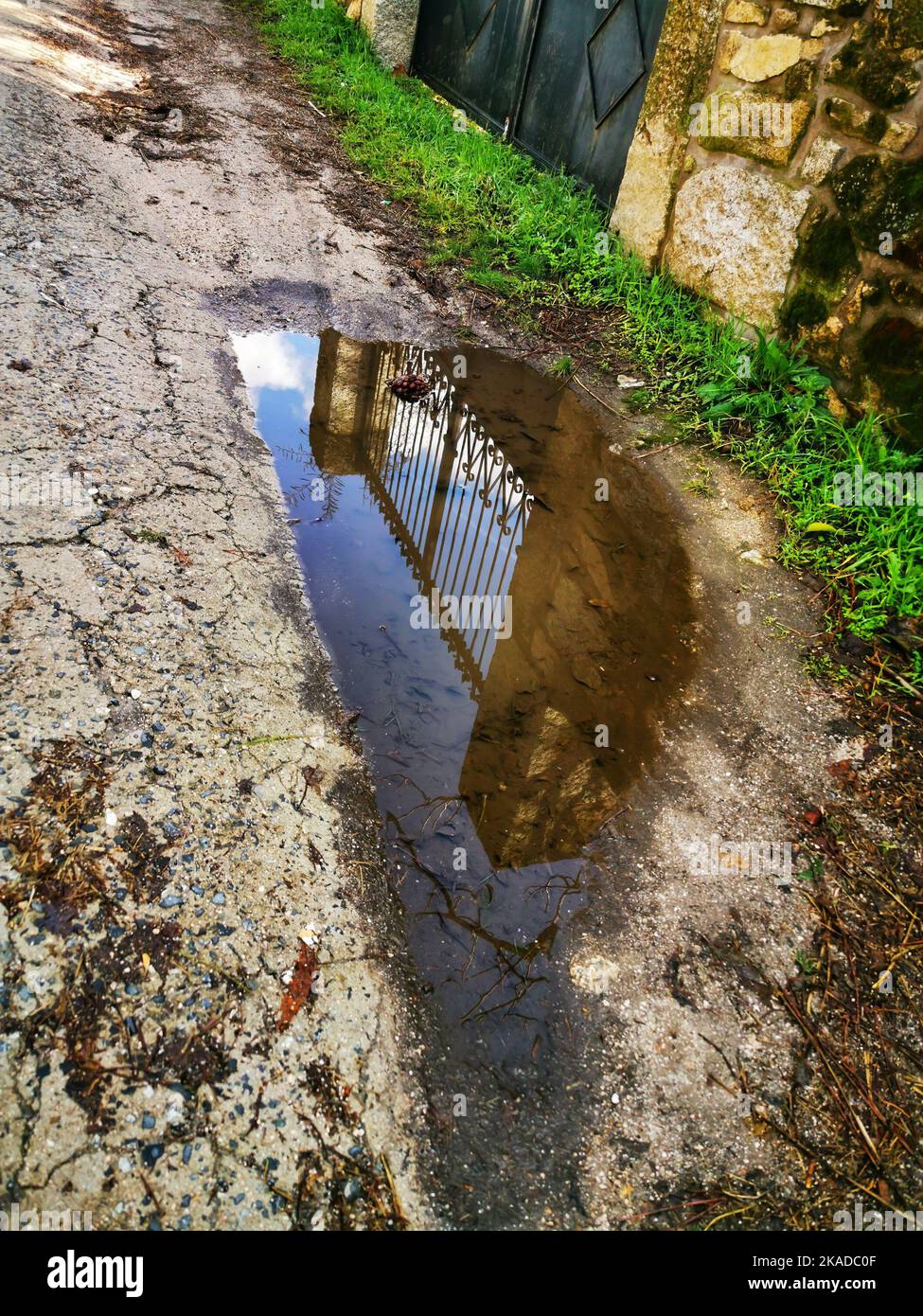 reflections in large puddles after a storm Stock Photo - Alamy