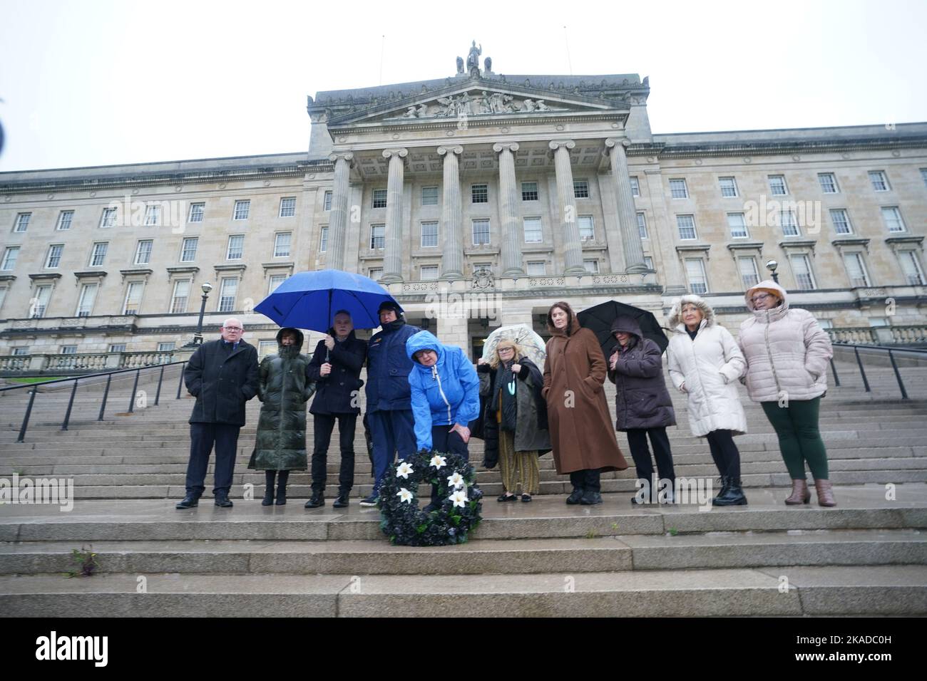 Dympna Kerr (centre), sister of Columba McVeigh lays a wreath as she ...