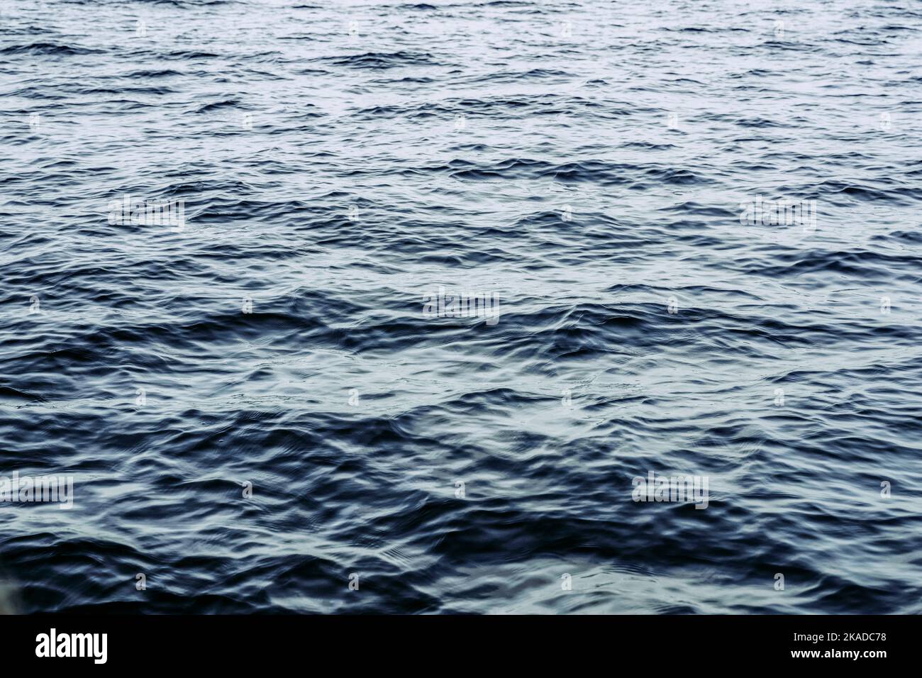 Bright blue Ocean water ripples background on a sunny day. Clean water ...