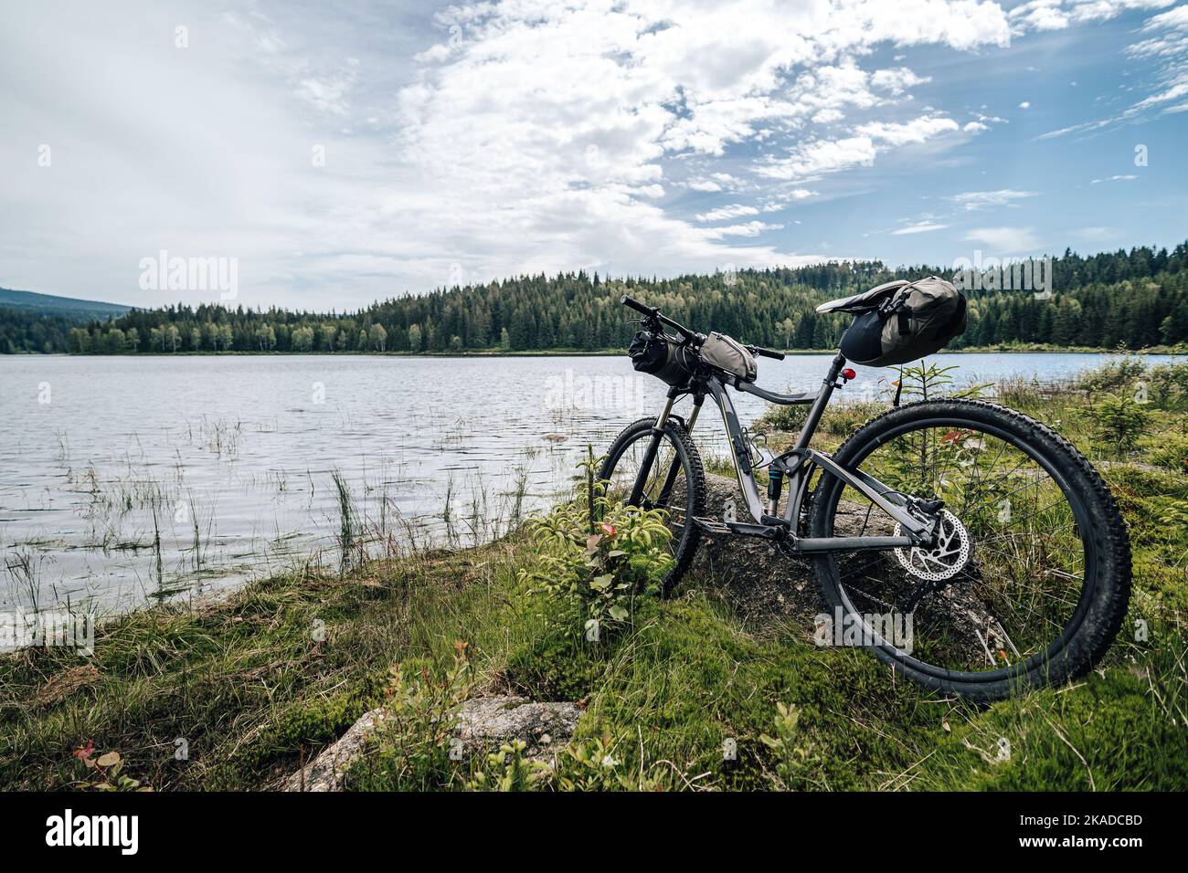 Bikepacking equipment on a mountain bike. Mountain bike with packed ...