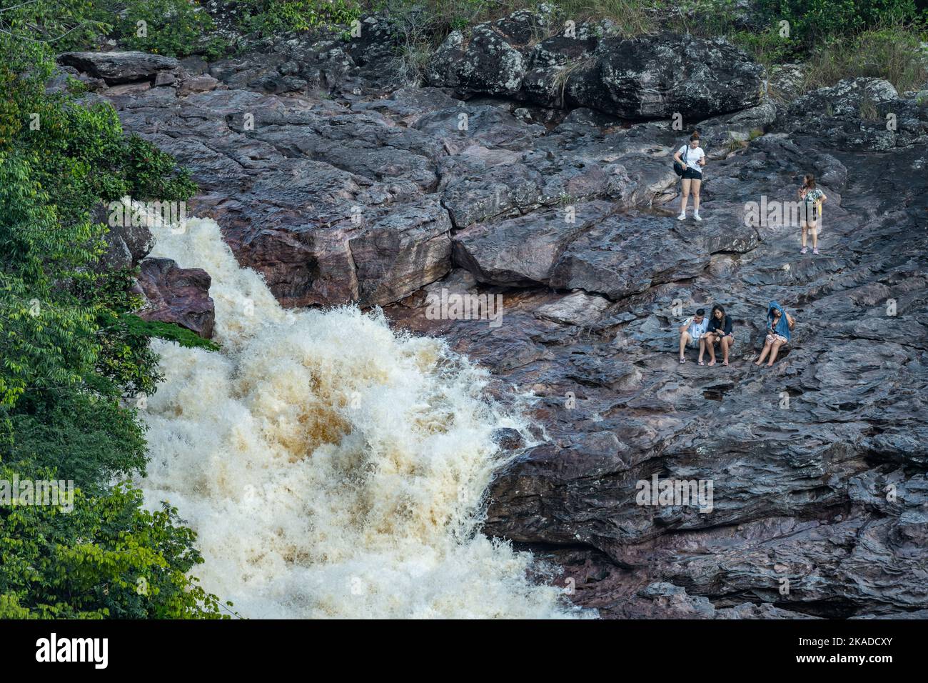 Local visitors enjoy the waterfall at the foot of Tepui mountain ...